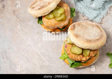 Salmon fishburger on english muffin Stock Photo - Alamy