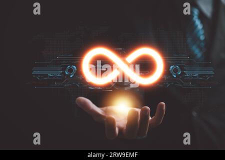 Circular infinity symbol in businessman's hand on dark background Stock ...