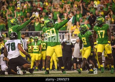 Oregon defensive tackle Popo Aumavae, left, participates in a position ...
