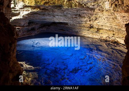 Poco Encantado, blue lagoon with sunrays inside a cavern in the Chapada ...