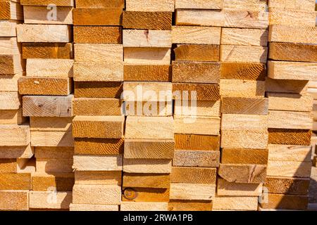 Yellow wooden chopped planks arranged in a row placed at the alfresco ...