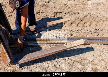 Construction worker ties reinforcing steel rebar. Close up Stock Photo ...