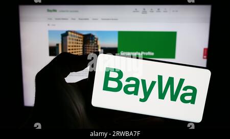 Smartphone with logo of German agribusiness company BayWa AG on screen ...