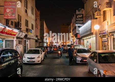 a quiet street at night in Manama, Bahrain, on the Pearling Path, a ...