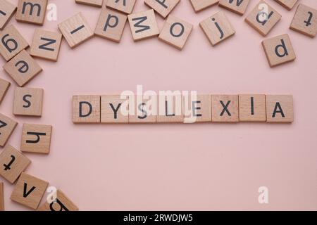Wooden cubes with word Dyslexia on pink background, flat lay Stock ...