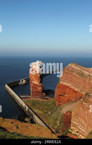 The steep coast of Helgoland with Helgoland's landmark, the Lange Anna ...