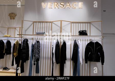 VERSACE CLOTHING ON DISPLAY INSIDE THE FASHION BOUTIQUE Stock Photo - Alamy