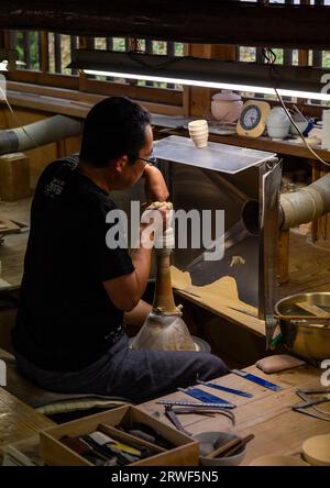 Artisan in Genemongama porcelain atelier, Kyushu region, Arita, Japan ...