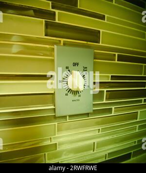 Iconic old-school wall-mounted kitchen appliance timer. Electrical ...