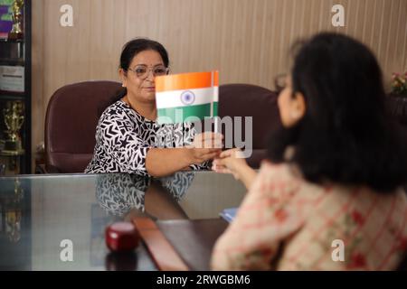 Principal Ma'am giving an Indian flag to a teacher as a gift, parent ...