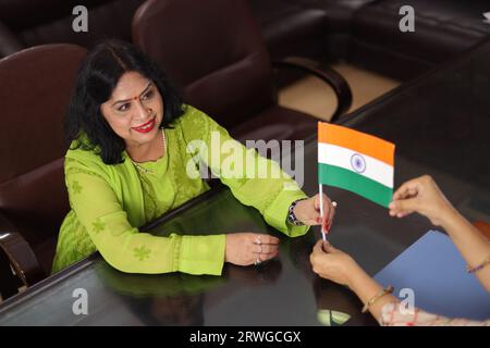 Principal Ma'am giving an Indian flag to a teacher as a gift, parent ...