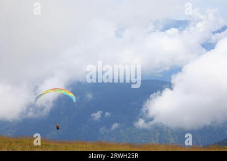 paragliding with two people on board for a couple flight and the clouds ...
