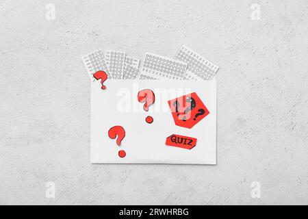 Envelope with quiz forms and question marks on white background Stock ...