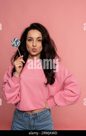 Photo of sweet brunette young lady hand face wear white shirt isolated ...