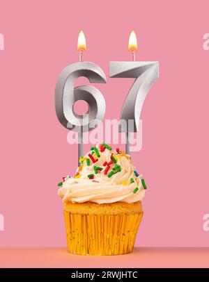 Birthday card number 67 - Cupcake with balloons Stock Photo - Alamy