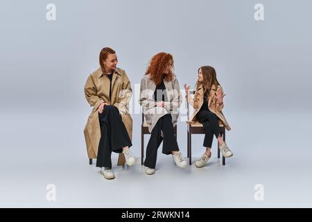 Three generations sitting on chairs Stock Photo - Alamy