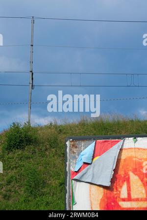 Torn billboard posters Stock Photo - Alamy