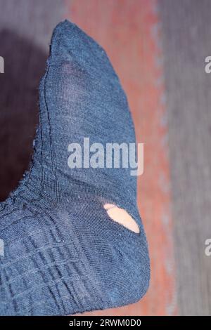hole in the sock Stock Photo - Alamy