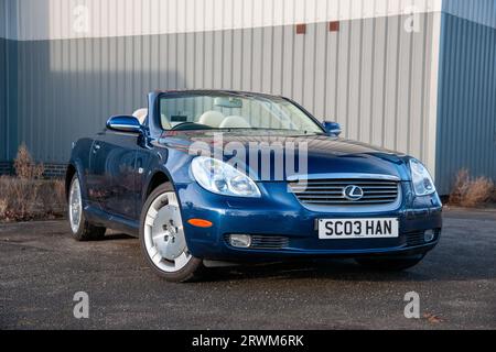 Blue Lexus SC convertible parked in an urban setting Stock Photo - Alamy