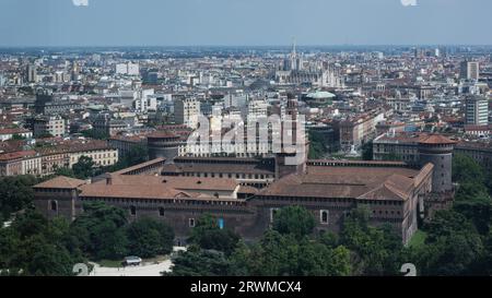 An aerial view of cityscape Milan surrounded by buildings in daylight ...