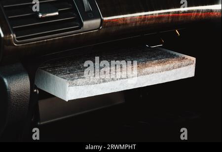 Car air conditioner filter clogged in mechanic hand with white ...