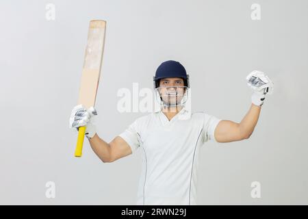 Man In cricket dress with helmet screaming in joy and anger, Cricketer ...