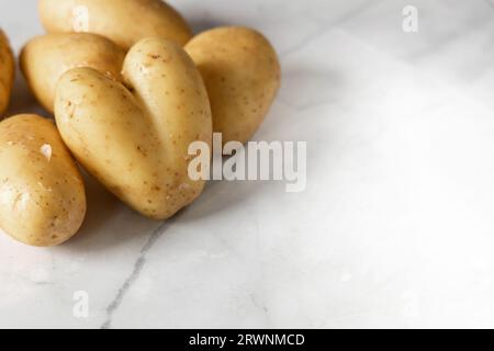 Heart shaped potatoes. A bunch of fresh potatoes Stock Photo - Alamy