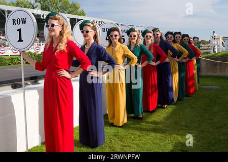Grid Girls line up to enter the track at The Goodwood Revival Meeting ...