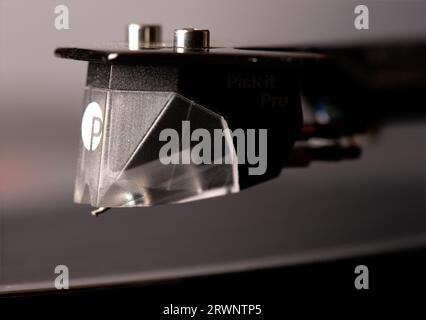 Pro-ject cartridge and stylus on a tonearm of a record player turntable ...
