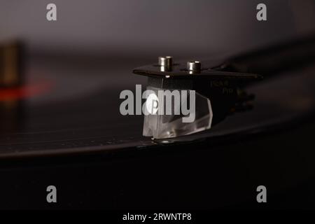 Pro-ject cartridge and stylus on a tonearm of a record player turntable ...