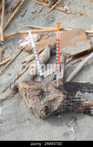 two abandoned infected syringes used by drug addicts to inject drugs ...