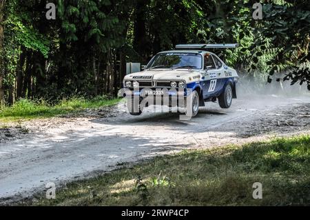 Vauxhall Firenza rally car jumping through the forest stage at the ...
