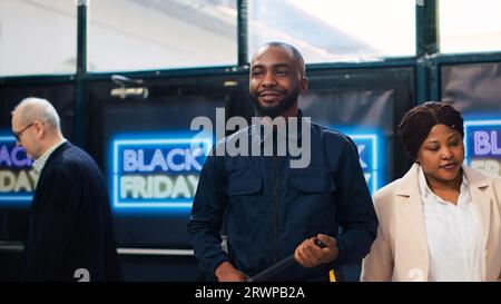 Patrol agent in shopping center with uniform and equipment, working to ...