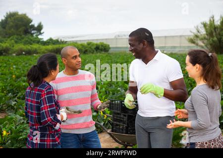 Conversation of farmers of different nationalities on field Stock Photo ...