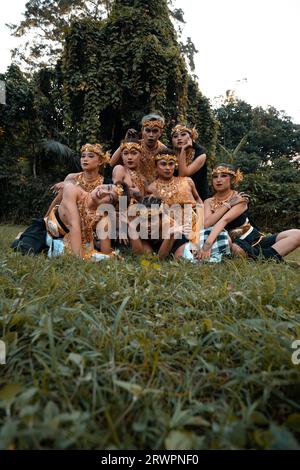 Javanese people with traditional dance costumes laying down on the ...