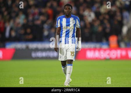 Jaheim Headley #15 of Huddersfield Town gets passed Lynden Gooch #2 of ...