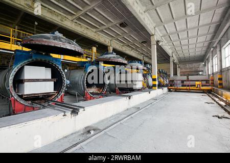 Raw blocks loaded into open tanks for material hardening Stock Photo ...