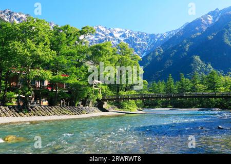 Kappa-bashi Bridge and lingering snow on the Hotaka mountain range in ...