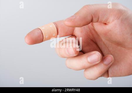 A finger with textile adhesive bandage. Short depth-of-field Stock ...