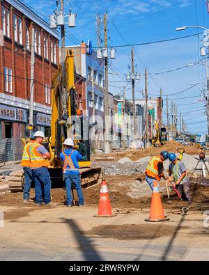 Workers are installing new water mains on a downtown street Stock Photo ...