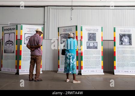 People viewing a Windrush Day exhibition / display at Tilbury Cruise ...