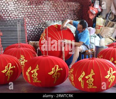 Workers make red lanterns for the upcoming Mid-Autumn Festival and ...