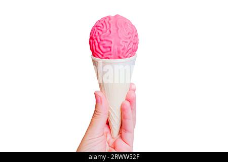 Human brain model in a waffle ice cream cone held in hand isolated on ...