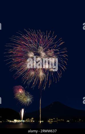 Night view of Mt. Fuji and the fireworks display at the Kawaguchiko ...