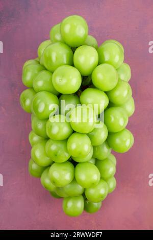Shine Muscat grapes on a white background. White grapes. Japanese ...