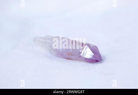 Brazilian amethyst fragment. Isolated over white fabric cloth Stock ...