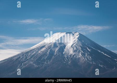 FUJIYOSHIDA, Japan - Snow-capped Mt. Fuji, seen from the city of ...