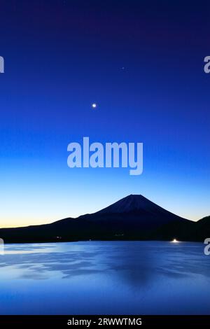 Dawn over Mount Fuji from the Asagiri Highlands, Japan, with bare trees ...