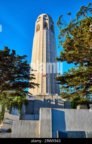 Coit Tower and American Flag under Clear Blue Sky Stock Photo - Alamy