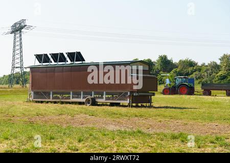 Mobile farm for growing laying hens. Mobile poultry farming Stock Photo ...